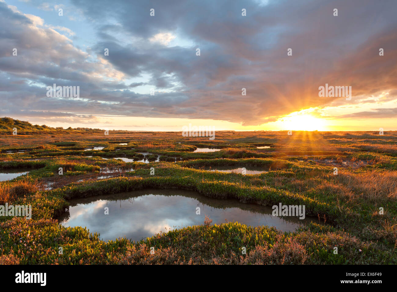 Sun burst Stiffey Marshes sunset North Norfolk coast Stock Photo - Alamy