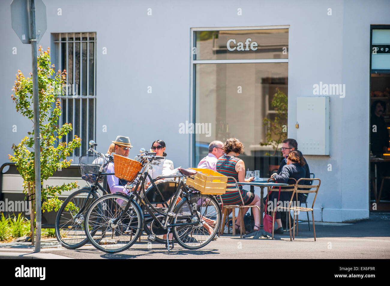 People enjoying sunny day outside a cafe Stock Photo - Alamy