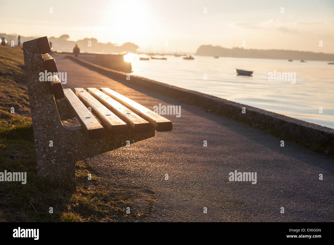 Golden bench at sunset on seafront of Sandbanks Poole Dorset UK Stock ...