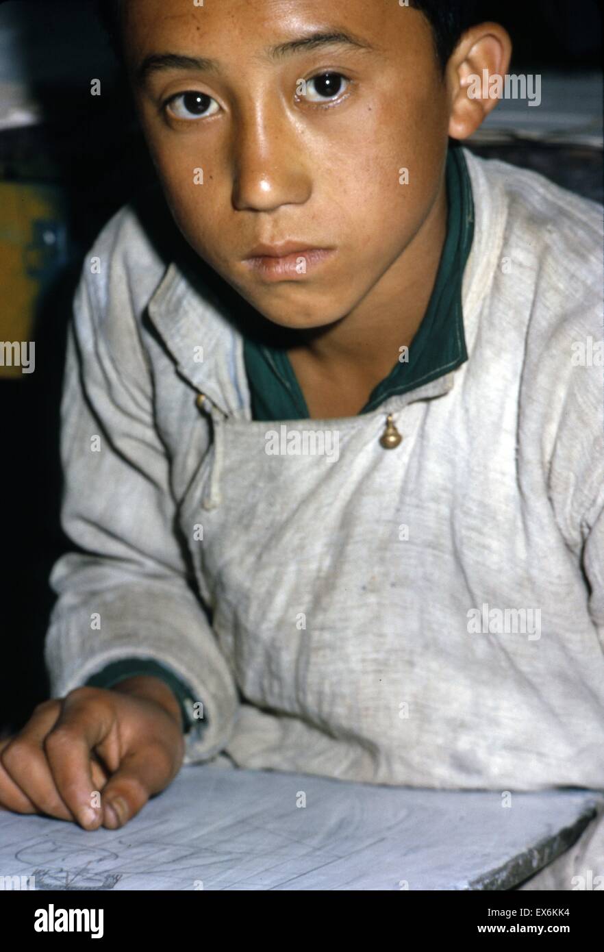 Colour photograph of a young boy from Bhutan in Northern India ...