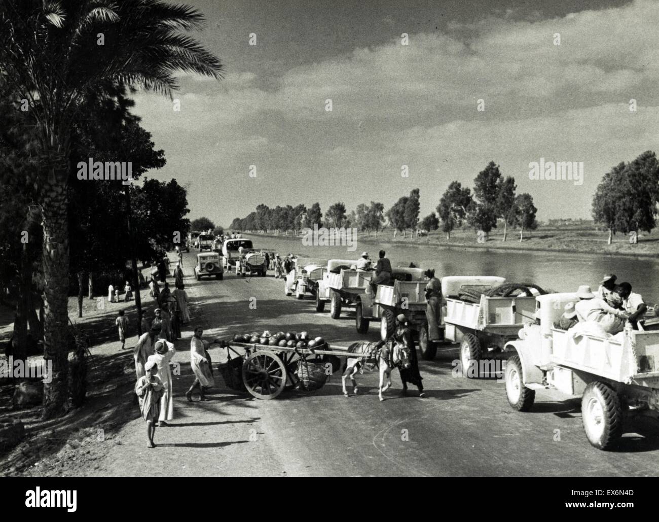 Photograph of military vehicles moving forward to the battle areas in ...