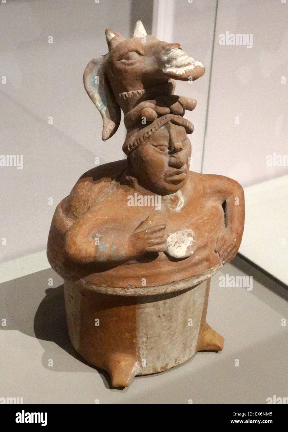 Anthropomorphic pot with lid wearing a cap representative of a deer's ...