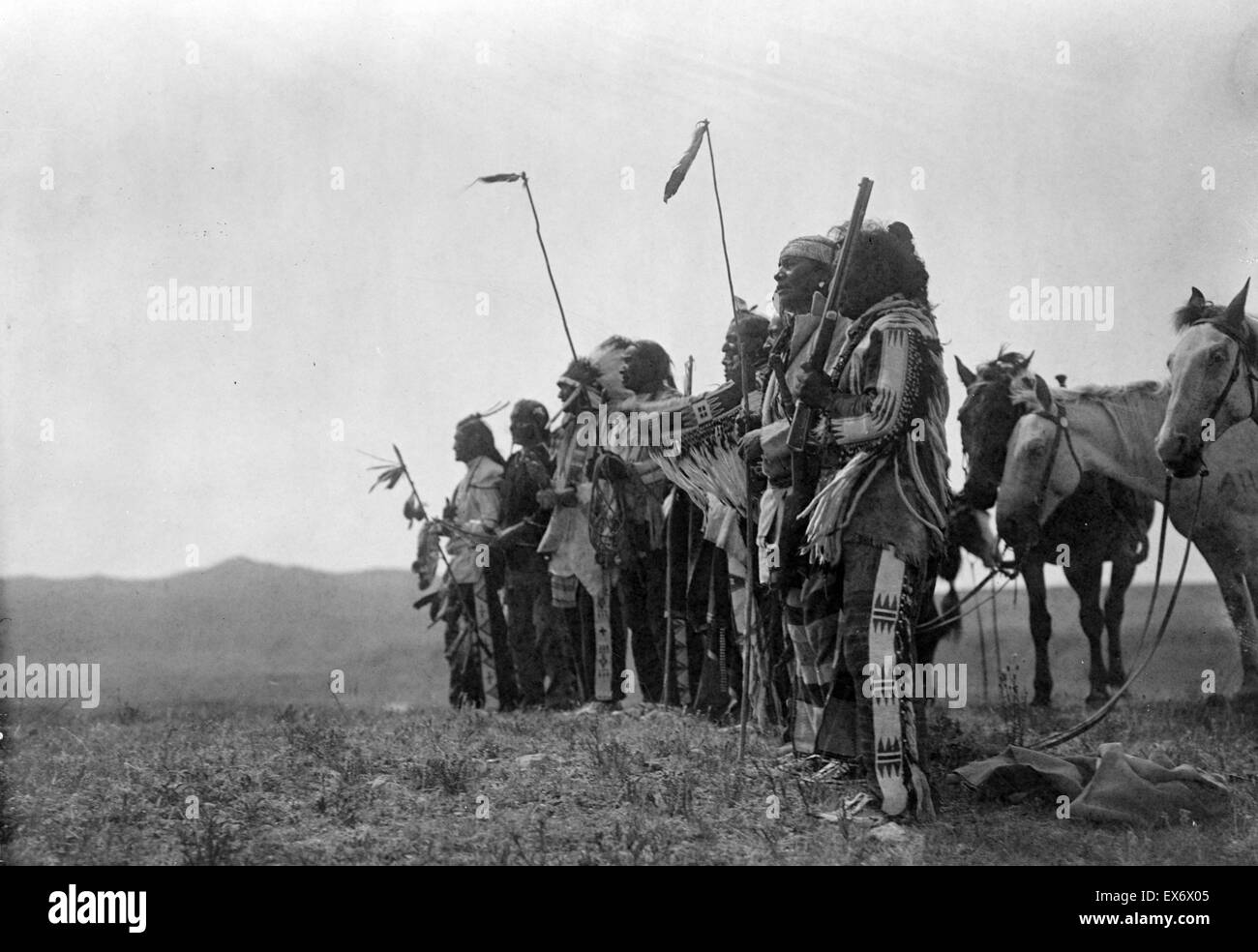 Photographic print depicting Atsina men awaiting the return of the ...