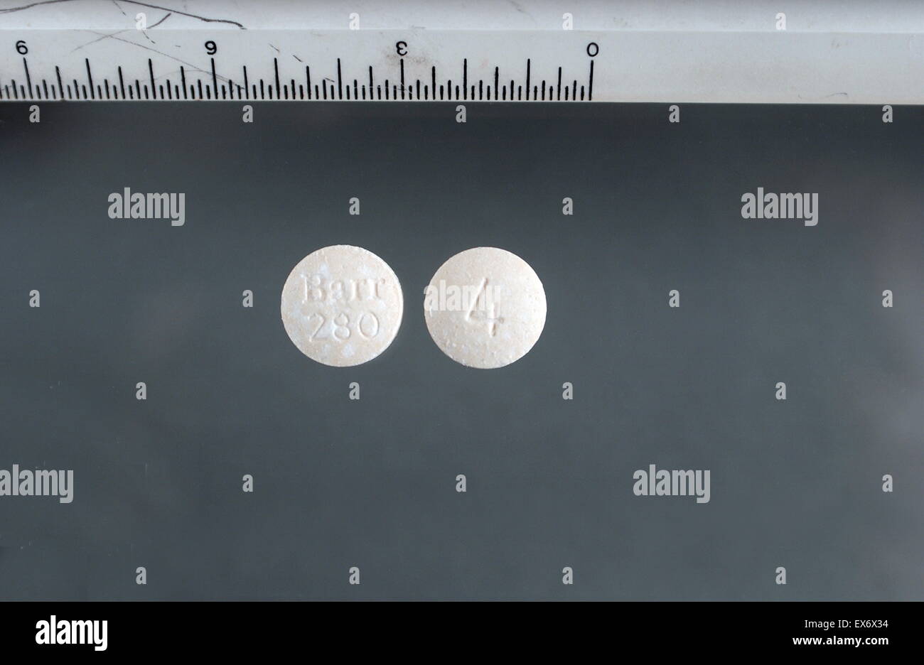An aspirin and a codeine tablet Stock Photo - Alamy