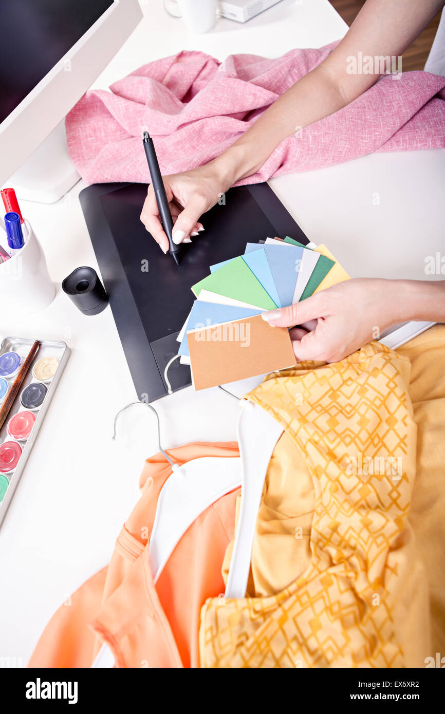 female fashion designer in the office at work Stock Photo - Alamy