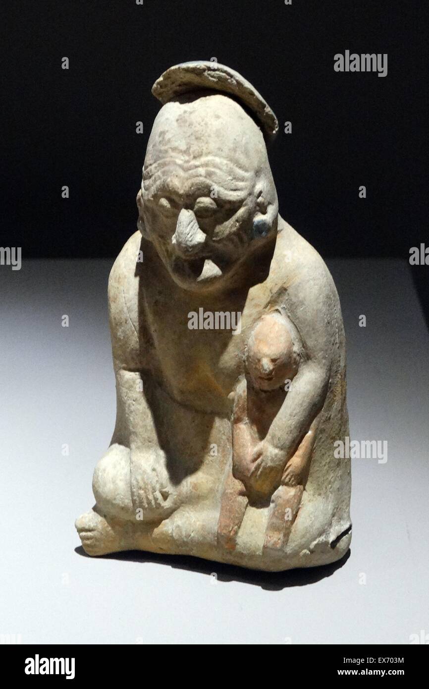 Mayan ceramic figurine of an old woman carrying a baby. from Jaina ...