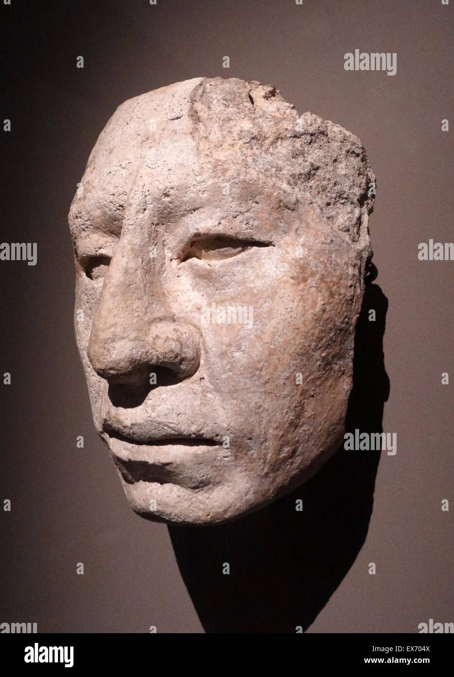 Mayan stucco portrait head of a male dignitary, with stylised hair. 600 ...