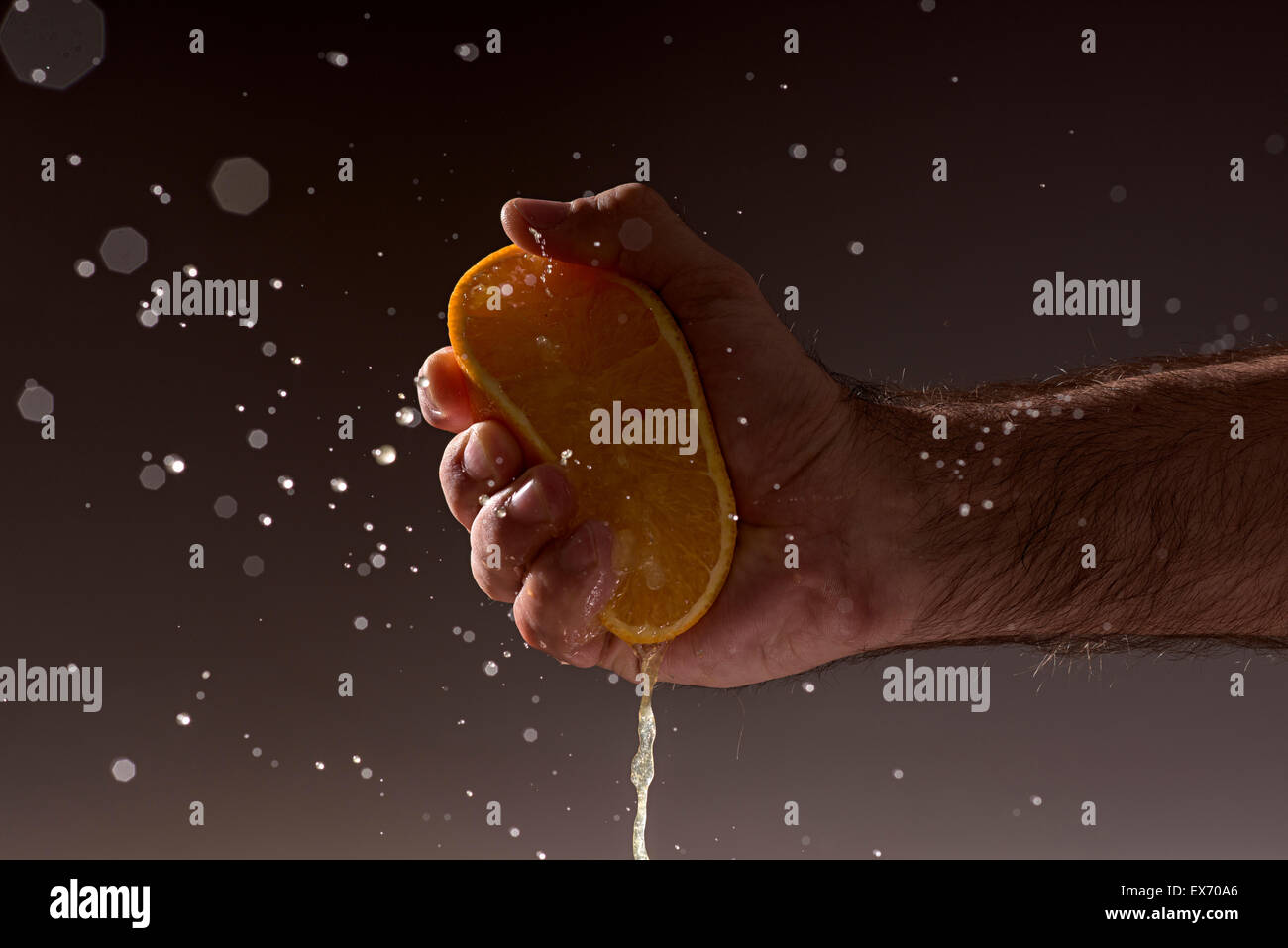 Male hand squeezing orange hi-res stock photography and images - Alamy