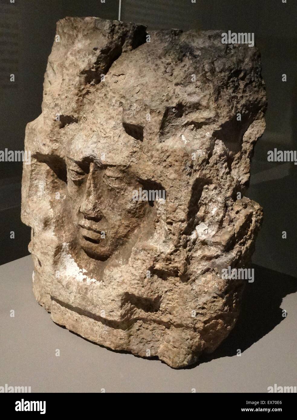 Mayan architectural detail of a face, from a façade in calcified rock ...