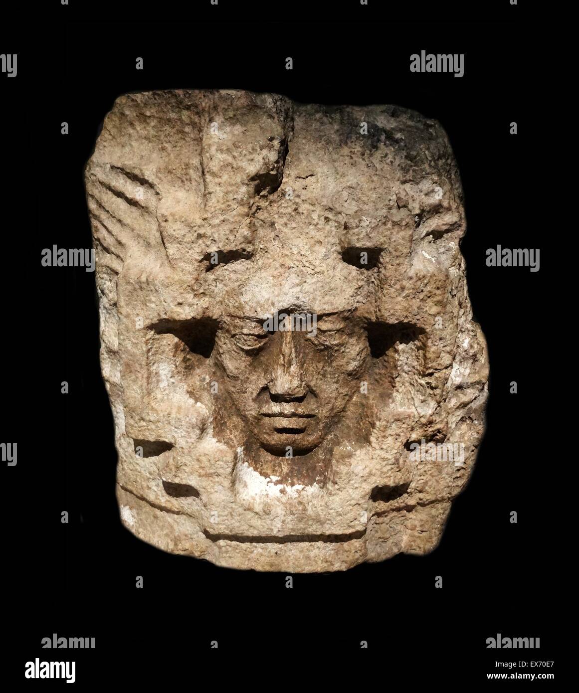 Mayan architectural detail of a face, from a façade in calcified rock ...