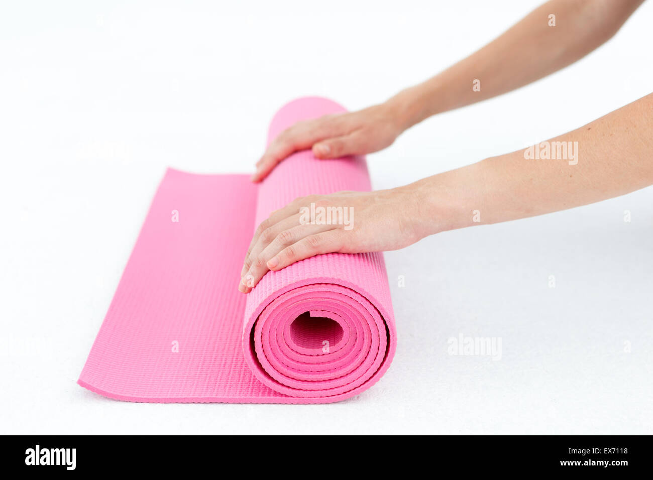 Young woman preparing for yoga class Stock Photo - Alamy