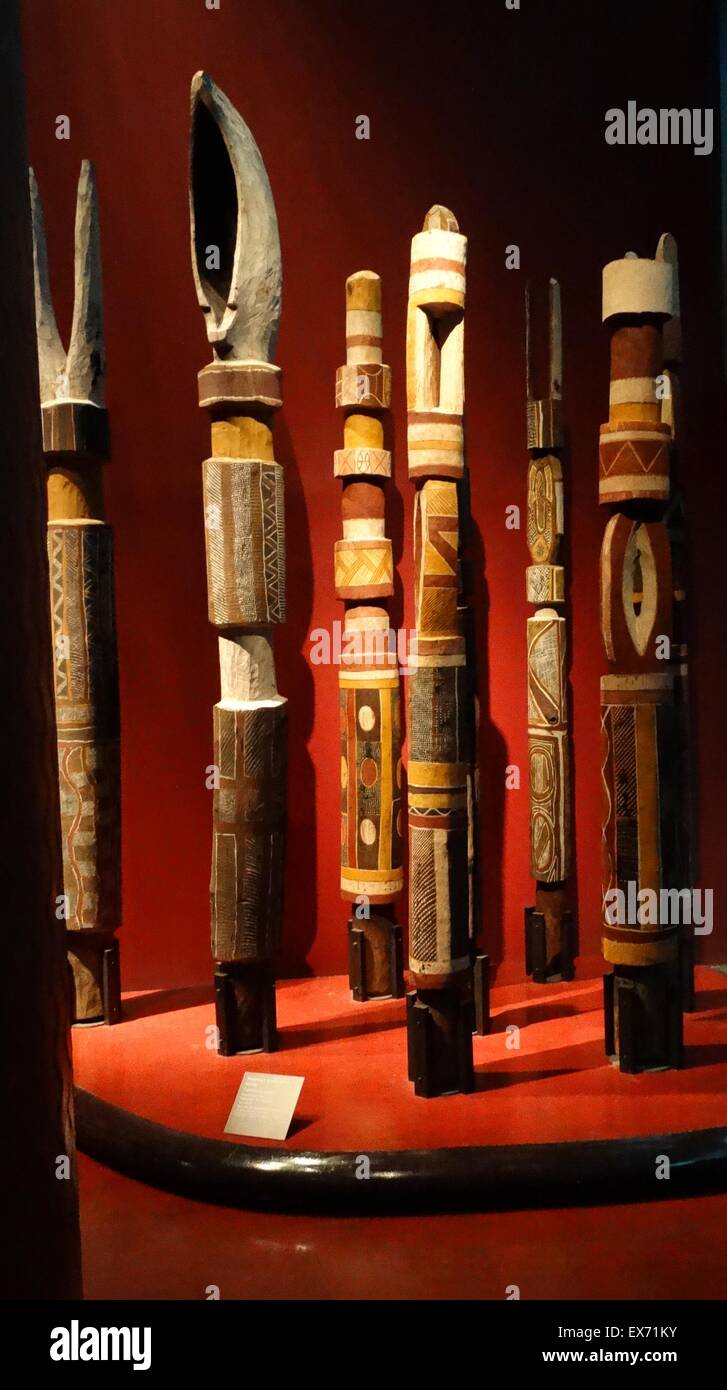 painted wooden, tribal funerary posts, made by the Tiwi people of ...