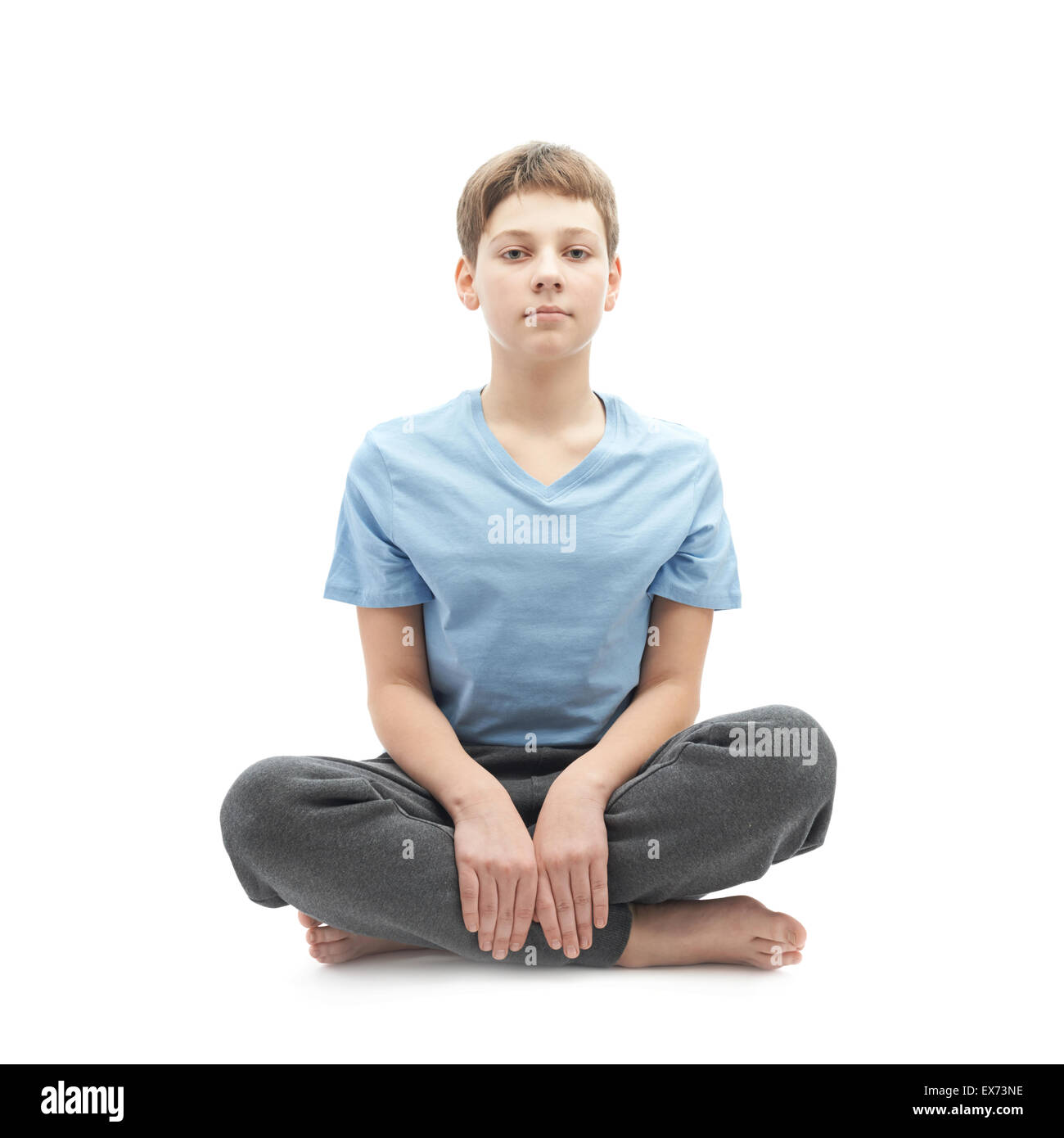 Young boy sitting in a lotus position Stock Photo - Alamy