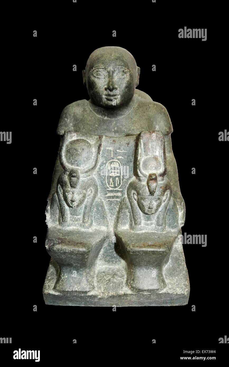 Serpentine statue of the official Harwa, presenting two female divine ...