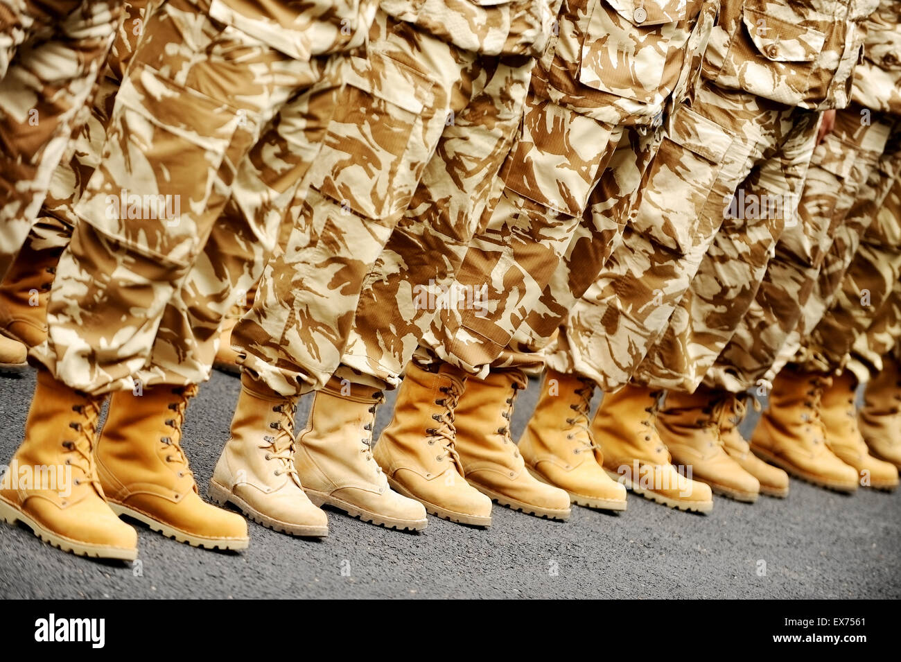 Soldiers feet in desert camouflage military uniform in rest position ...