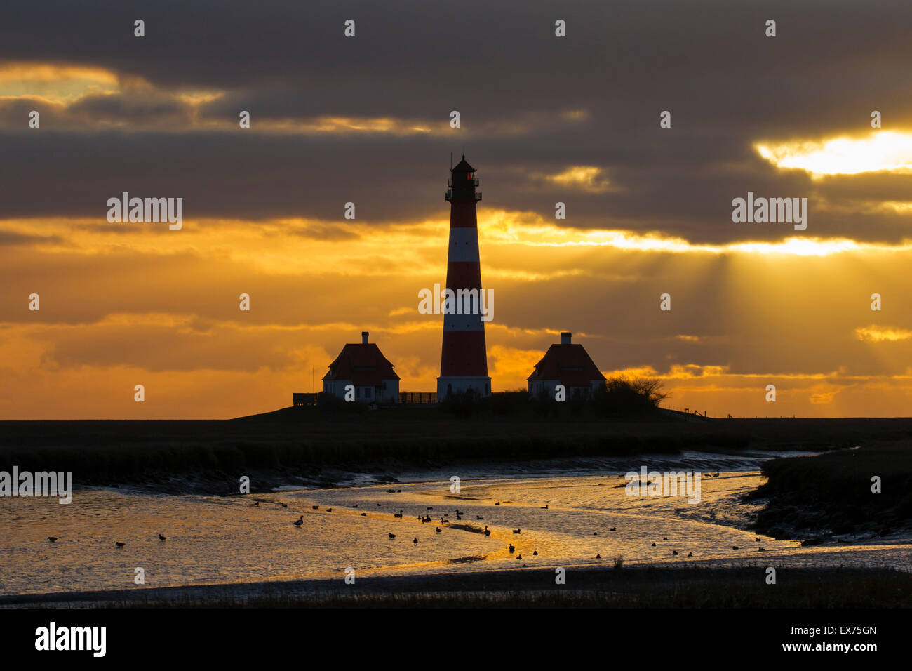 Lighthouse Westerheversand at sunset at Westerhever, Wadden Sea ...