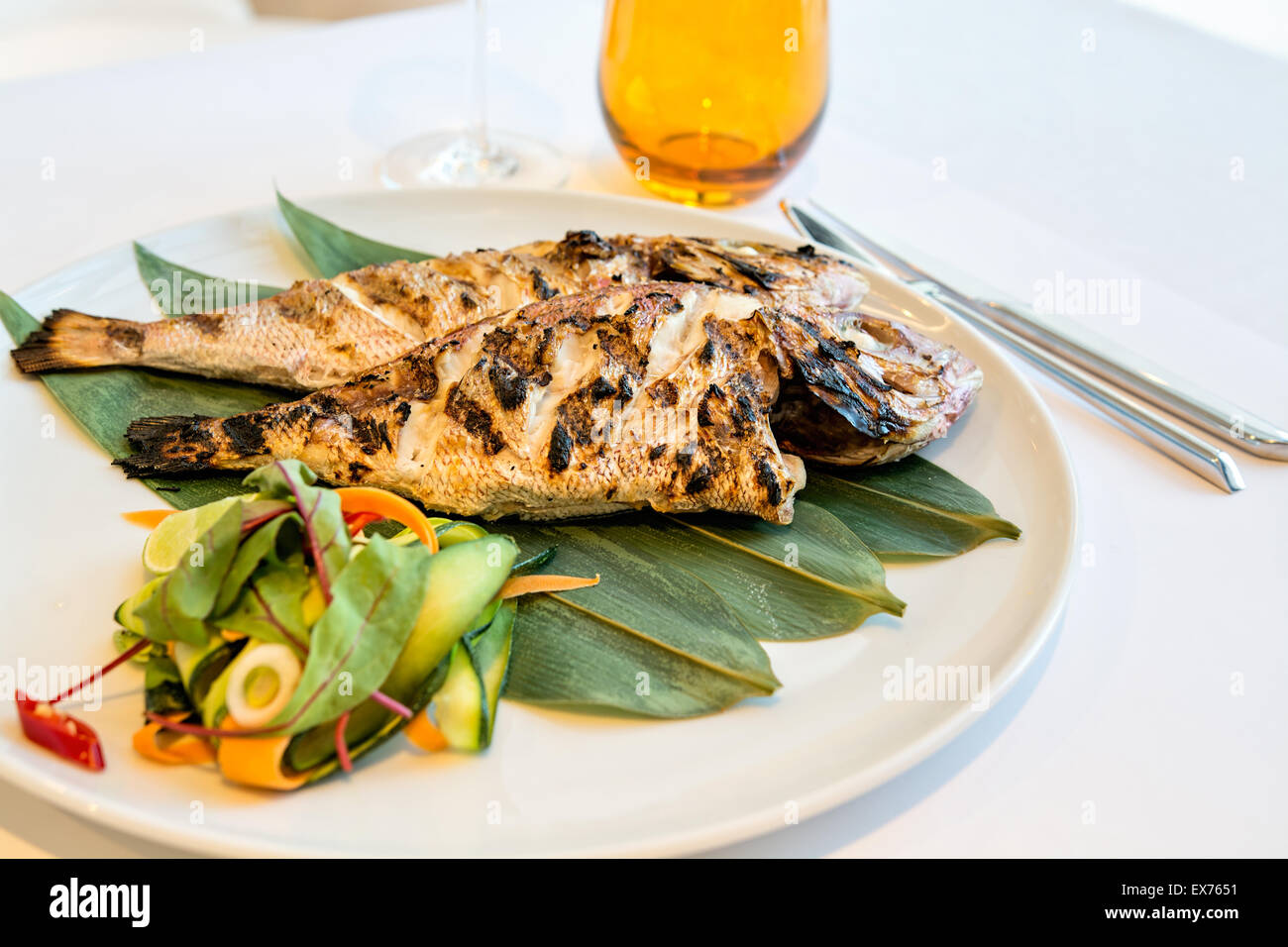 grilled fish with fresh vegetables Stock Photo - Alamy