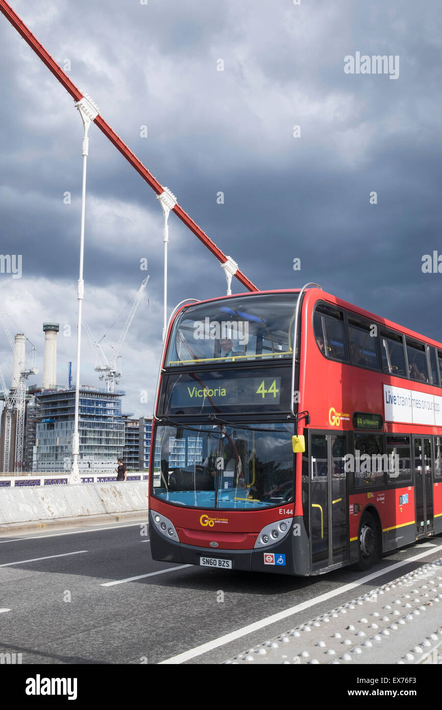 Red double decker bus crossing Chelsea Bridge London England UK Stock ...