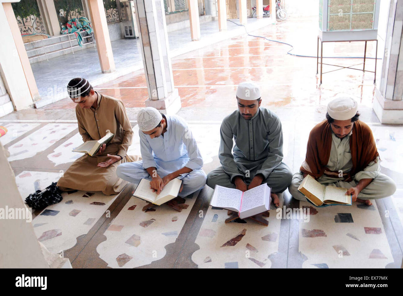 Faithful Muslims recite the Holy Quran during Itikaf at local mosque ...