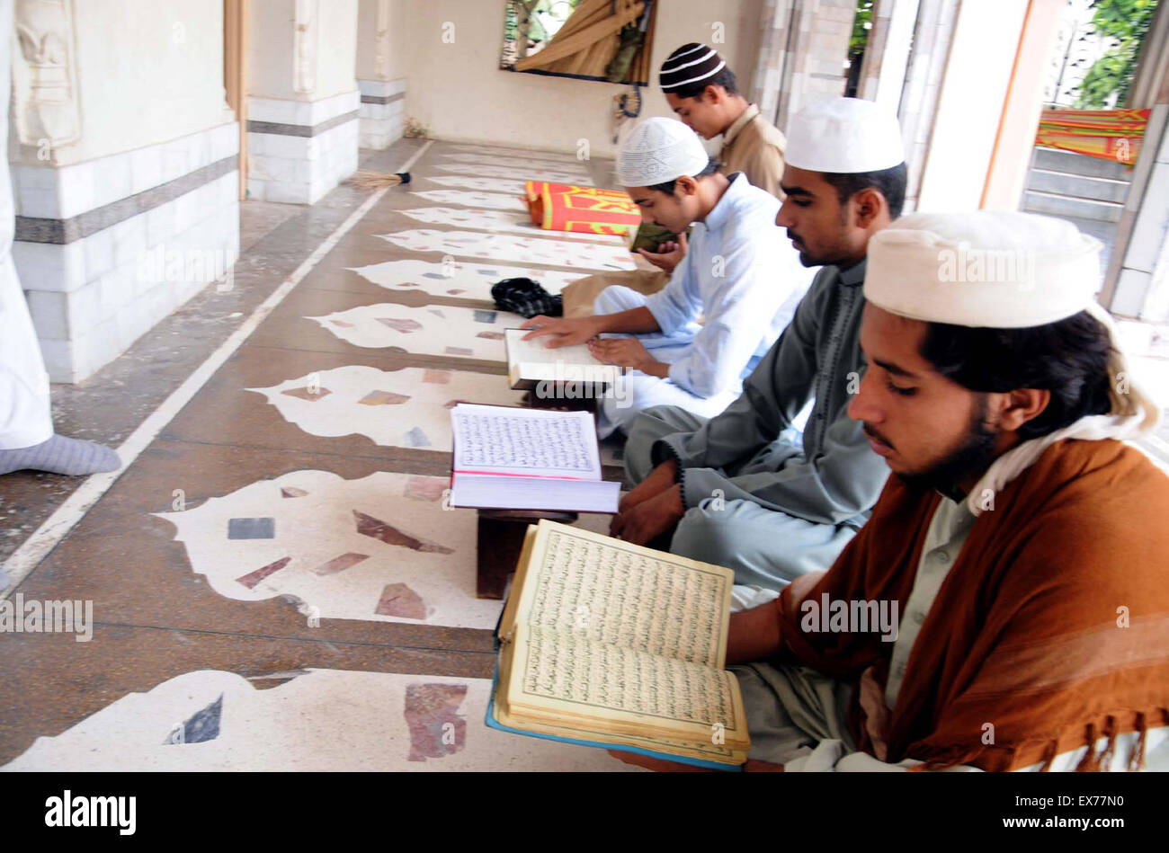 Faithful Muslims recite the Holy Quran during Itikaf at local mosque ...