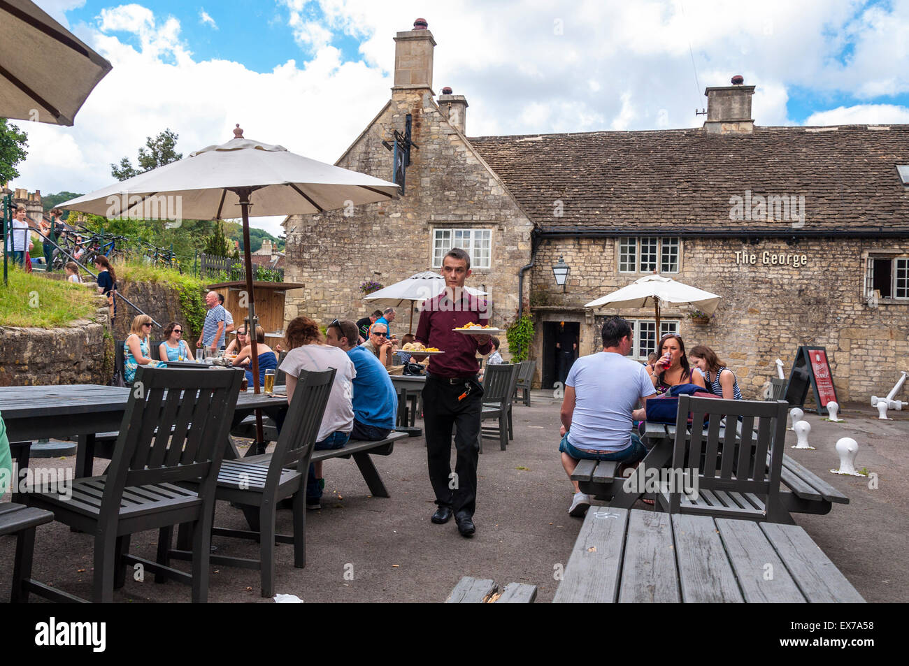 People enjoying a drink outside The George pub in Bathampton, Bath ...