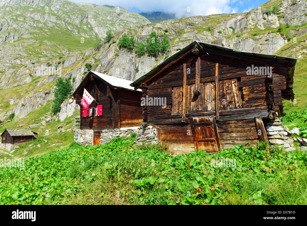 Two traditinal alpine huts seen in the swiss alps Stock Photo - Alamy