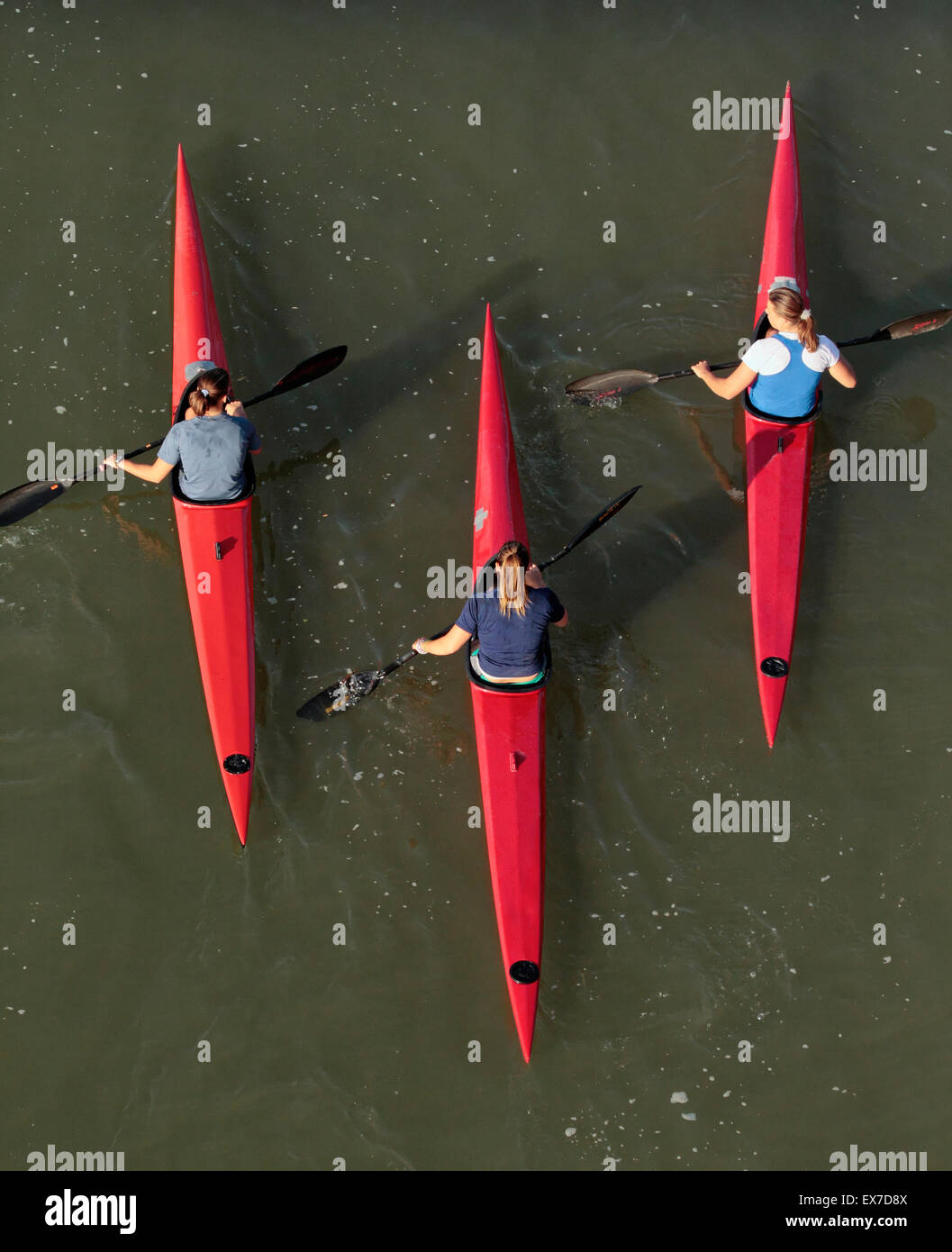 Three female kayakers on the water from above Stock Photo - Alamy