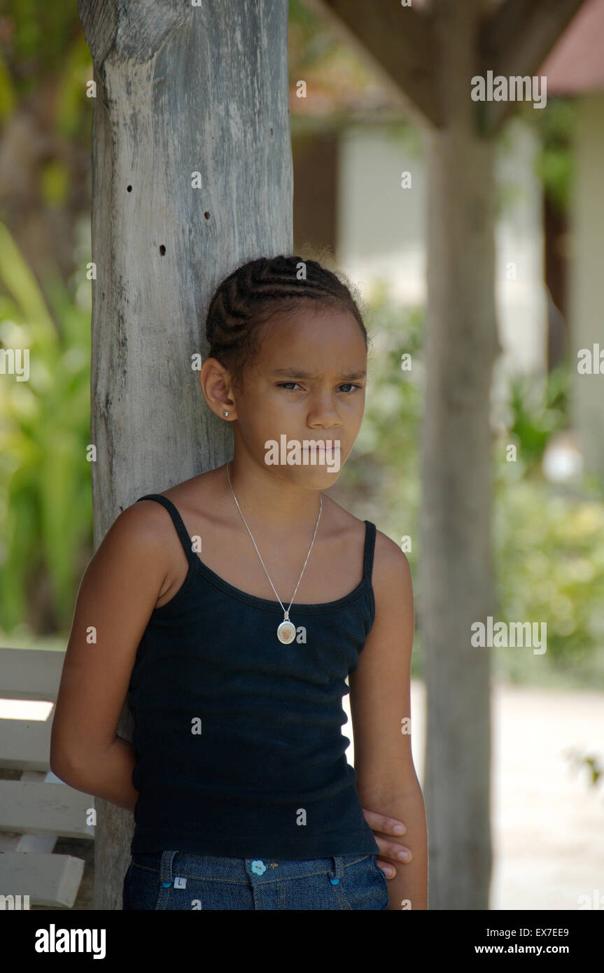 Creole girl is leaning against a tree, Denis island, Seychelles Stock ...