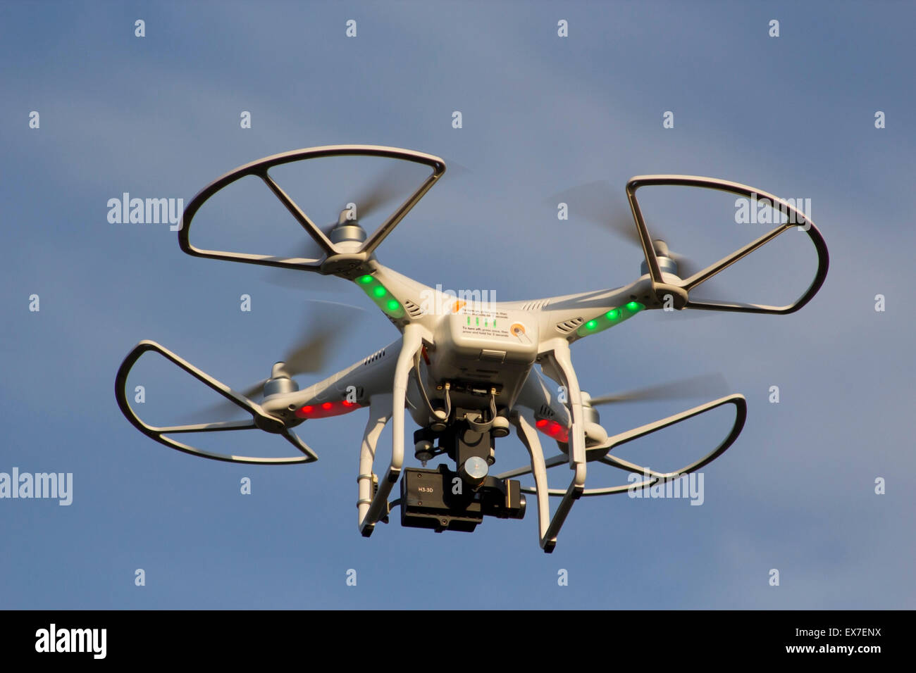 Phantom 2 Quadcopter with GoPro camera flying against blue sky Stock ...