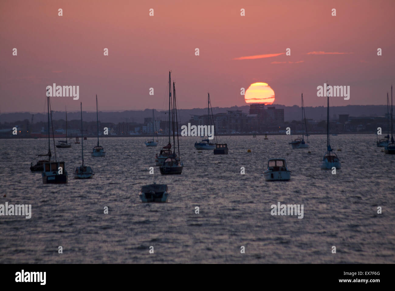 Sunset over poole harbour from sandbanks hi-res stock photography and ...