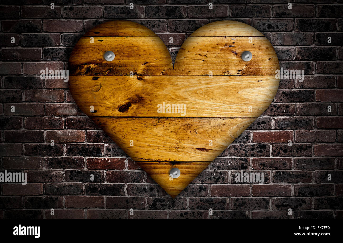 Wooden heart over a brick wall Stock Photo - Alamy