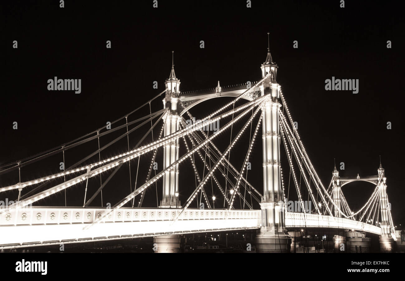 LONDON, ENGLAND - London's Albert Bridge in Chelsea, lit up by night on ...