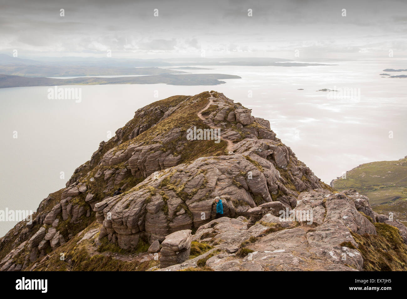 Walkers descending Ben Mor Coigach towards Loch Broom, looking towards ...