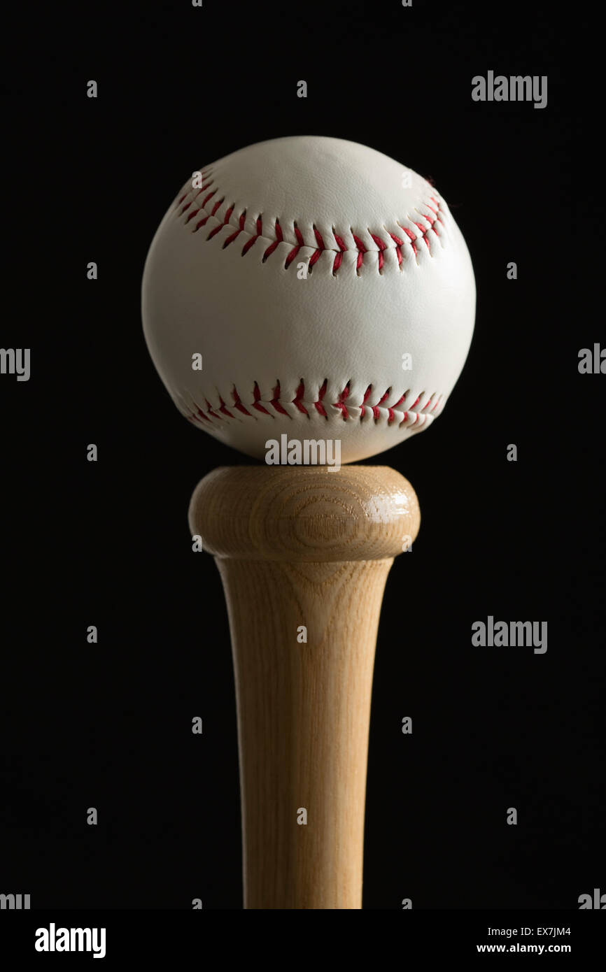 Baseball on top of bat Stock Photo - Alamy