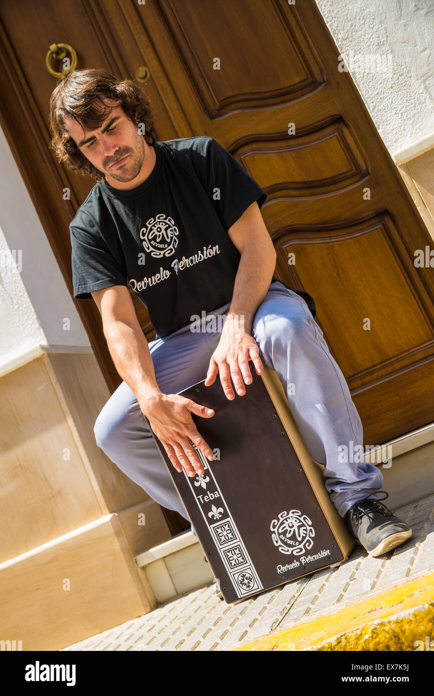 Flamenco percussionist playing a cajon in an Andalusian street stetting ...