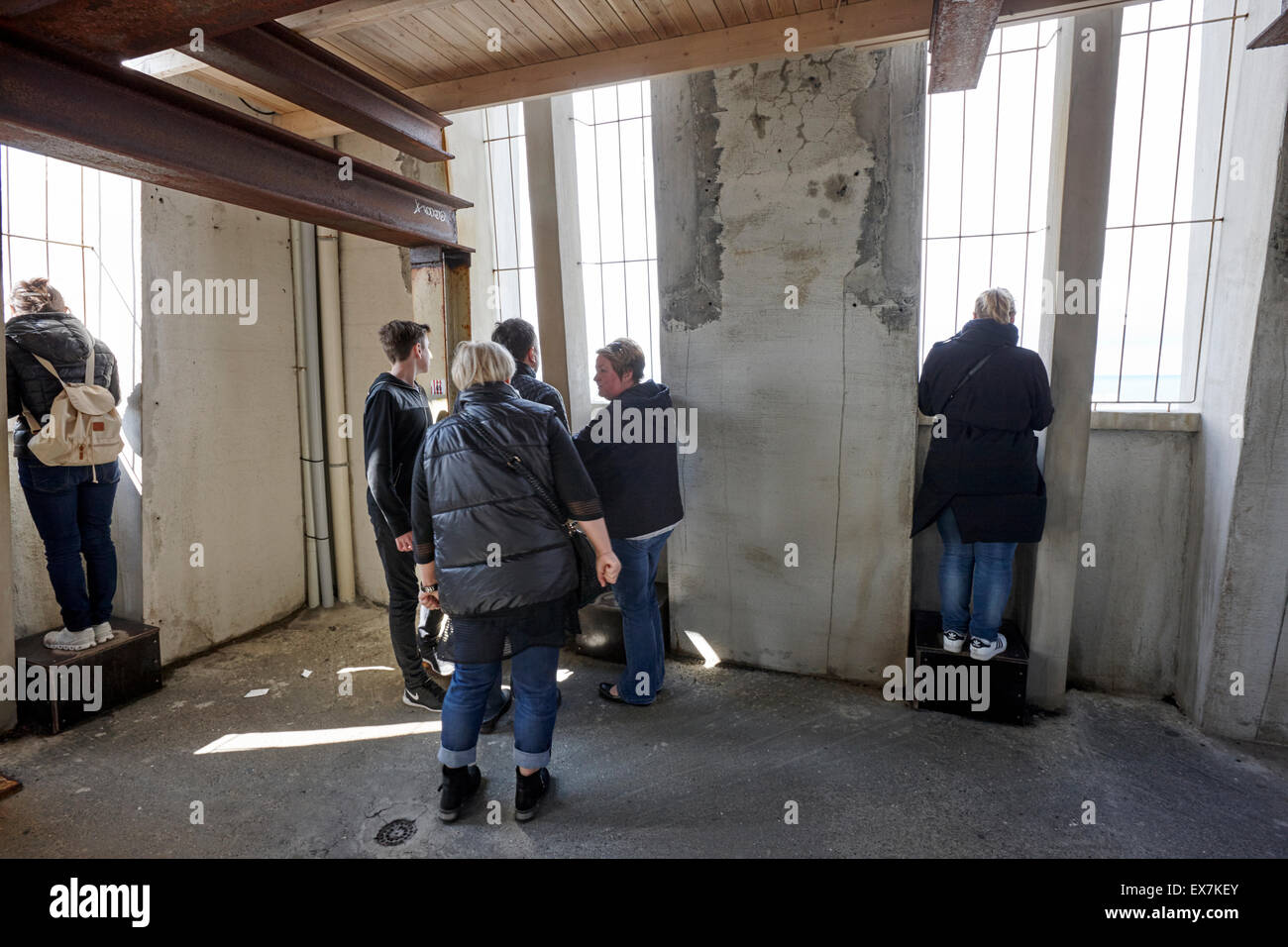 tourists inside the tower observation deck of Hallgrimskirkja church ...