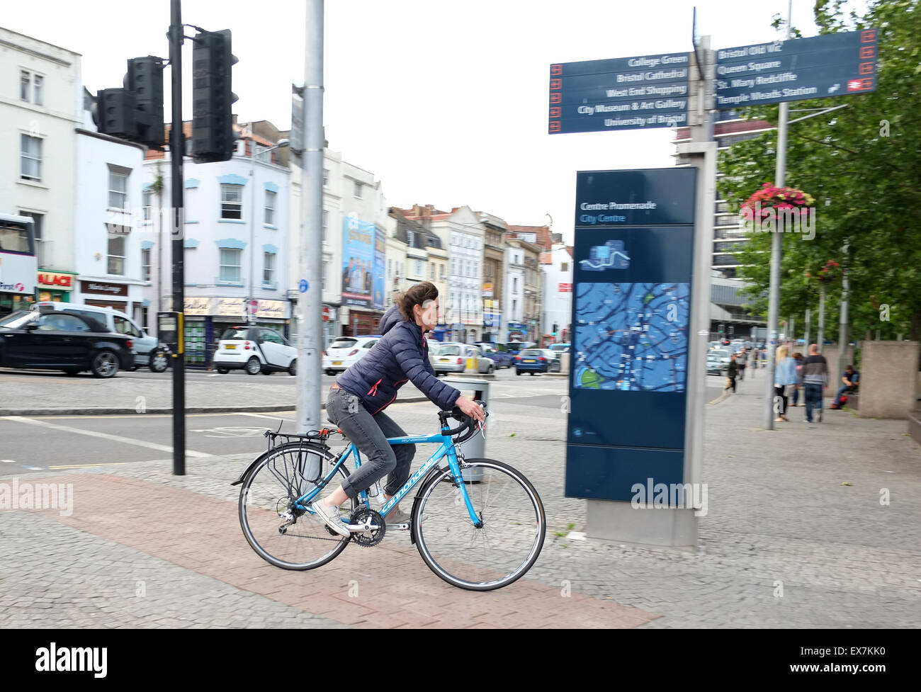 young woman cycling in Bristol city centre, 8th July 2015 Stock Photo ...