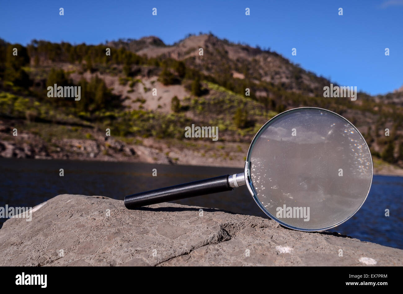 Magnify Glass Loupe on the Volcanic Rock Stock Photo - Alamy