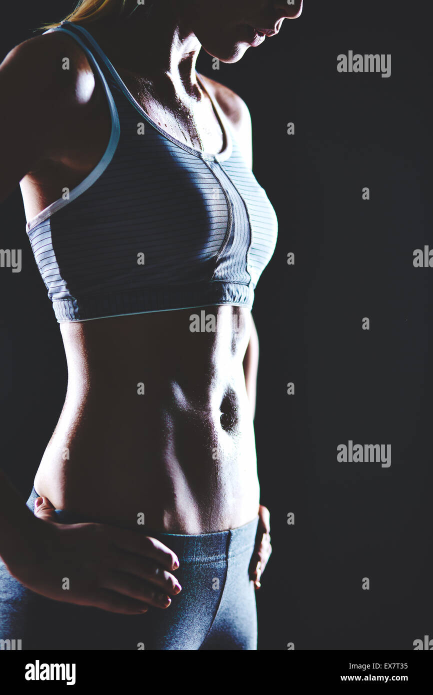Body of slim female in activewear Stock Photo - Alamy