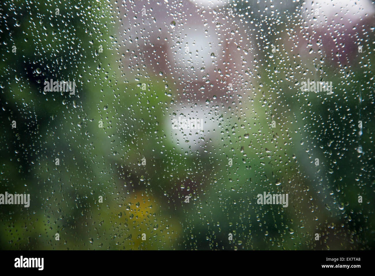 A window with rain streaks on it Stock Photo - Alamy