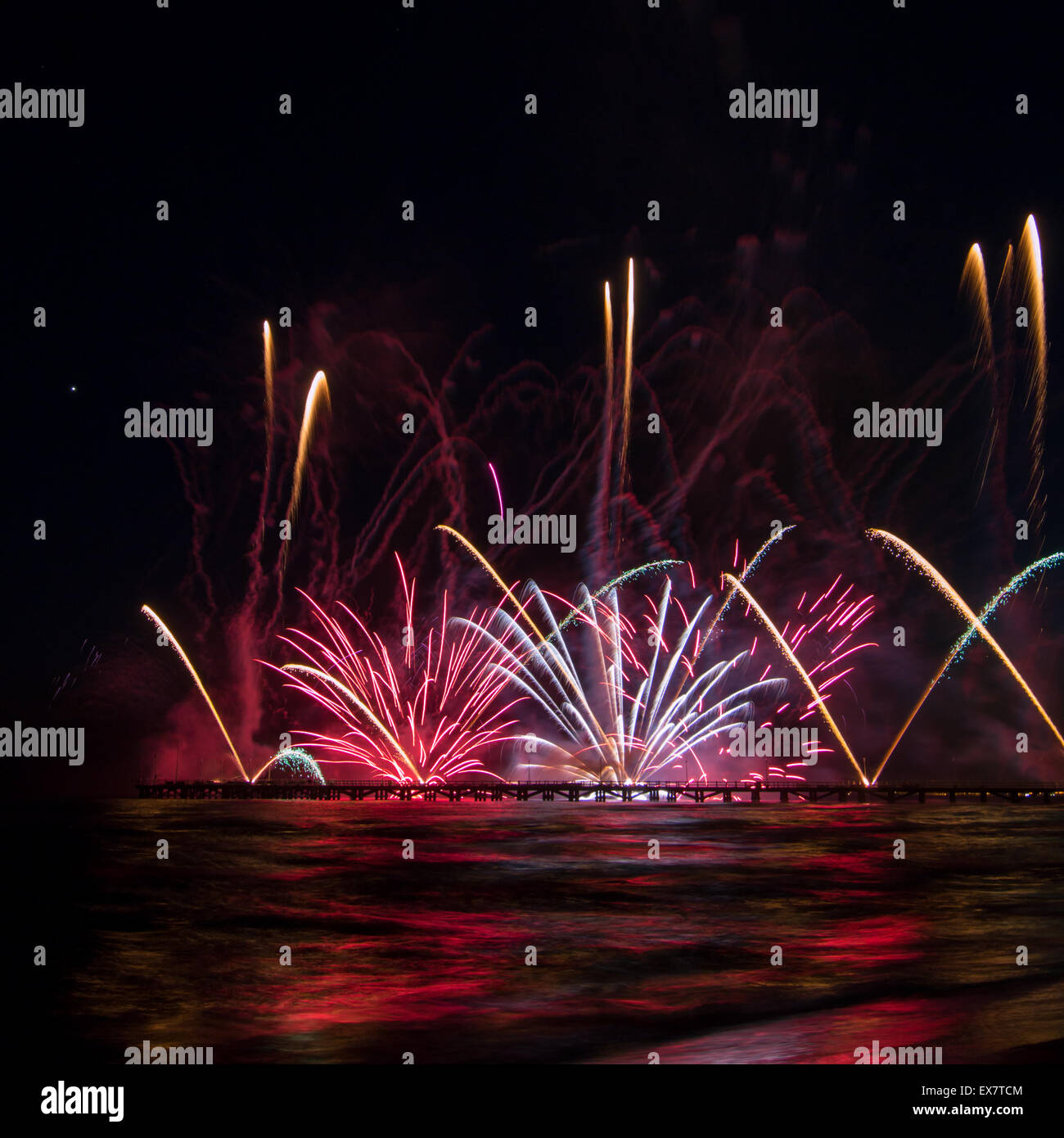 Fireworks reflecting in the water during australia exhibition at ...