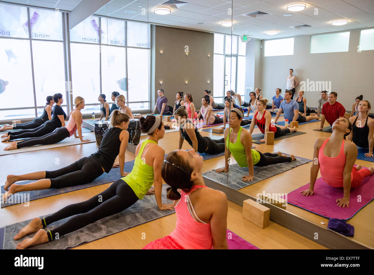 Vinyasa yoga class Stock Photo - Alamy