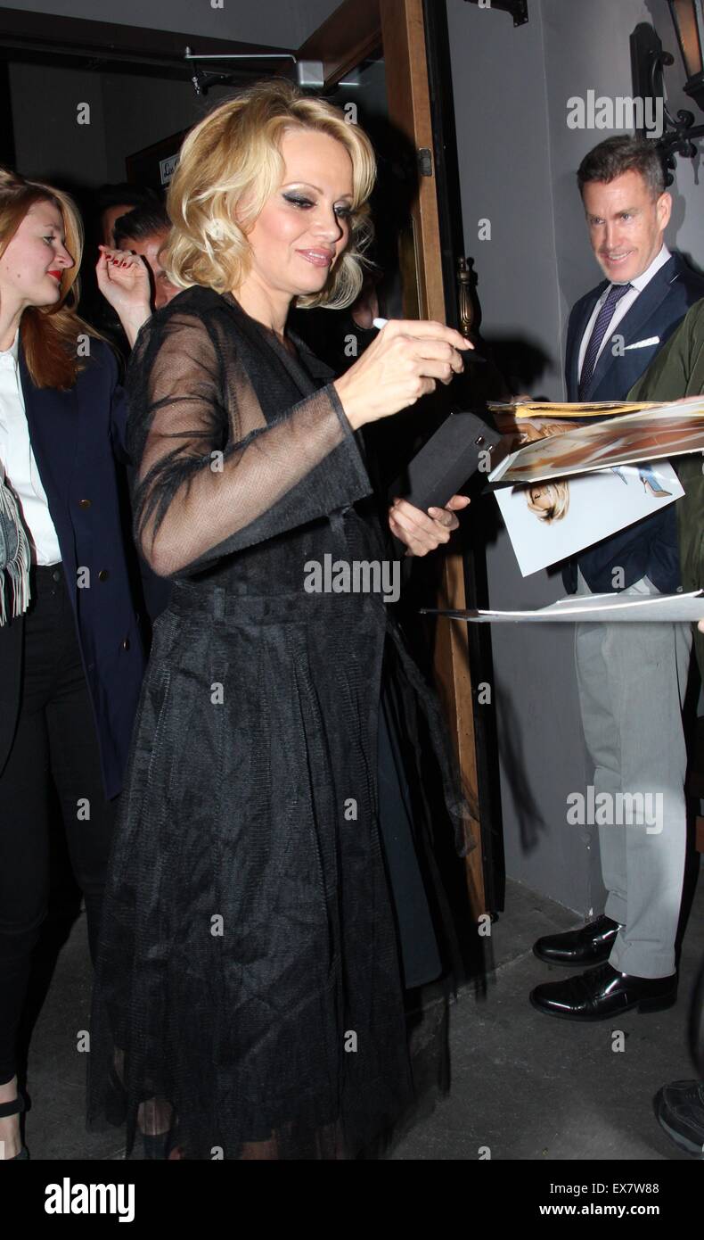 Pamela Anderson, wearing a sheer black dress, leaves Crossroads Vegan ...