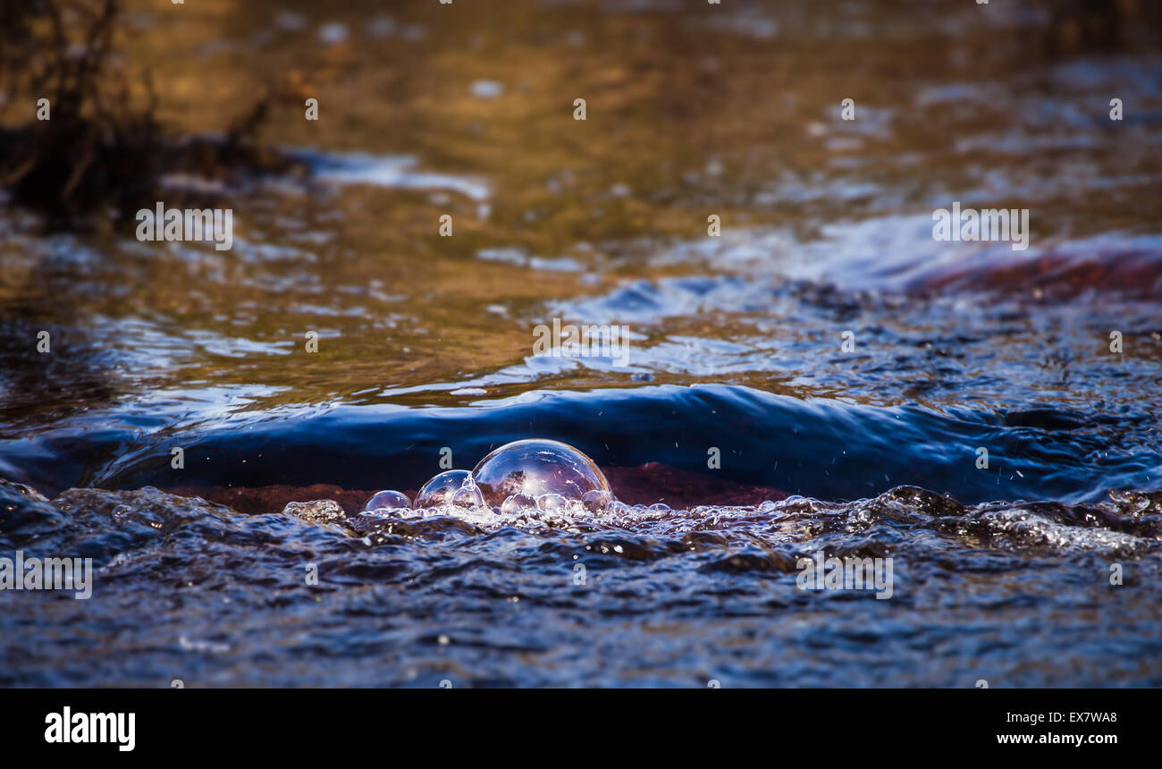 A bubble in a small river Stock Photo - Alamy