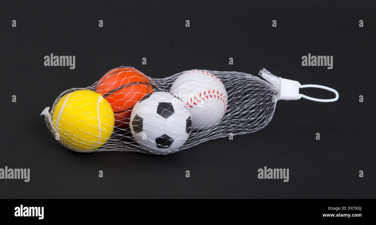 Small toy balls isolated on black background Stock Photo - Alamy