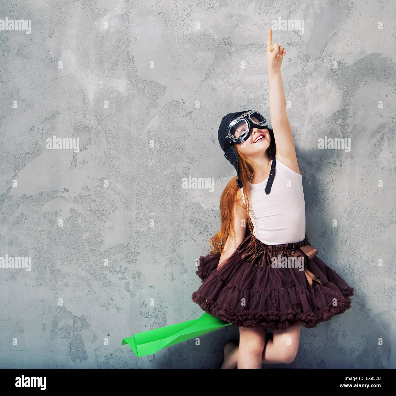 Portrait of a cute little pilot girl Stock Photo - Alamy