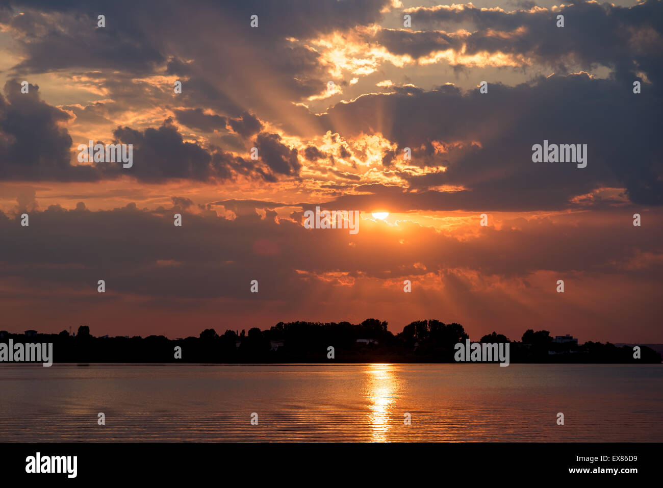 Summer Sunrise With Beautiful Cloudy Sky Over Calm Lake Water Stock ...