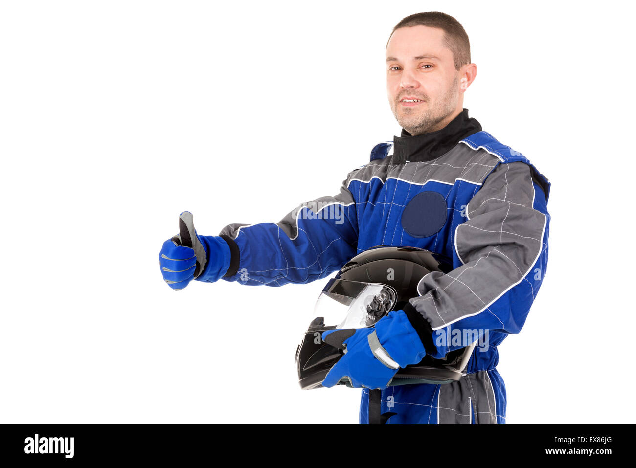 Racing driver posing with helmet isolated in white Stock Photo - Alamy