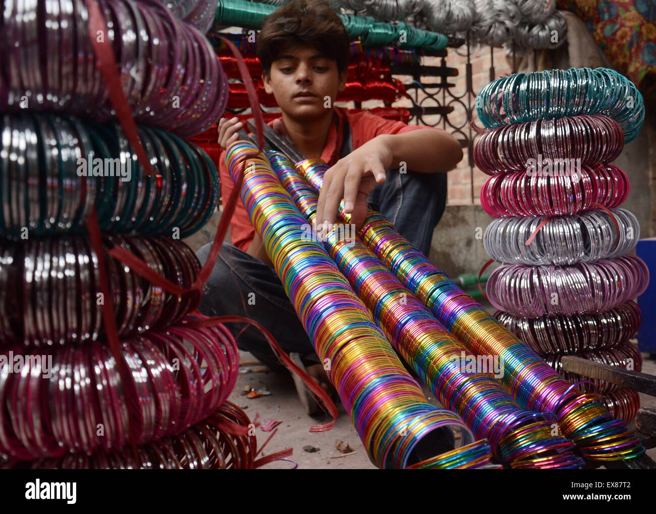 Lahore, Pakistan. 09th July, 2015. Pakistani workers are busy preparing ...