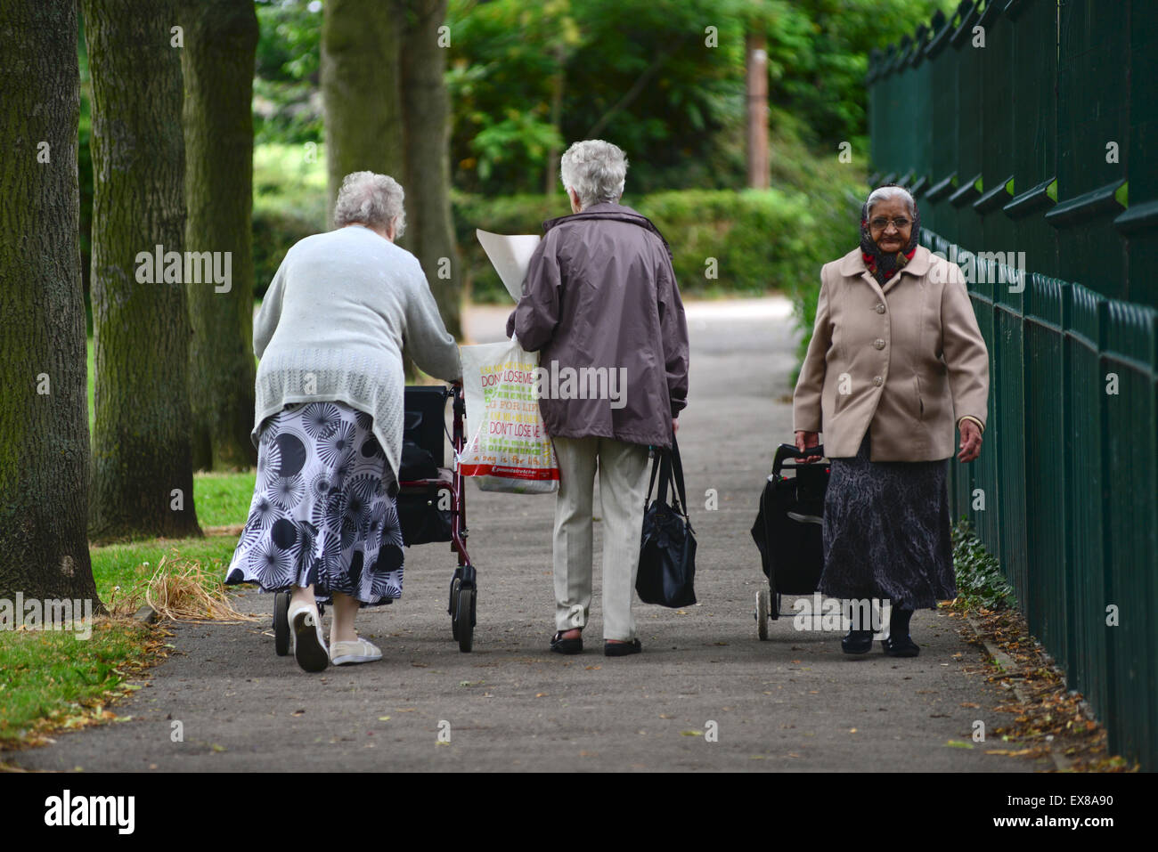 Elderly ladies walking though a park. Picture: Scott Bairstow/Alamy ...